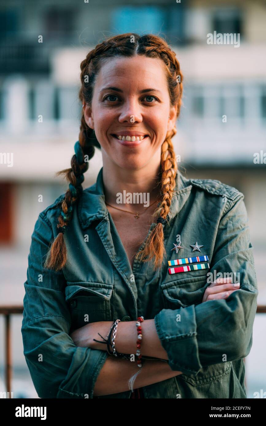 Pretty red-haired girl with braids. It is in the city of Madrid Spain ...