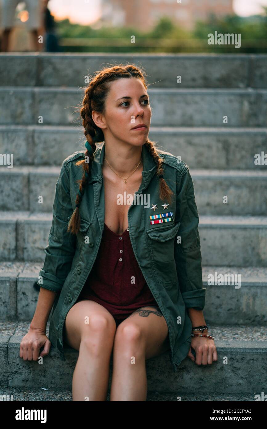 Pretty red-haired girl with braids. It is in the city of Madrid Spain ...