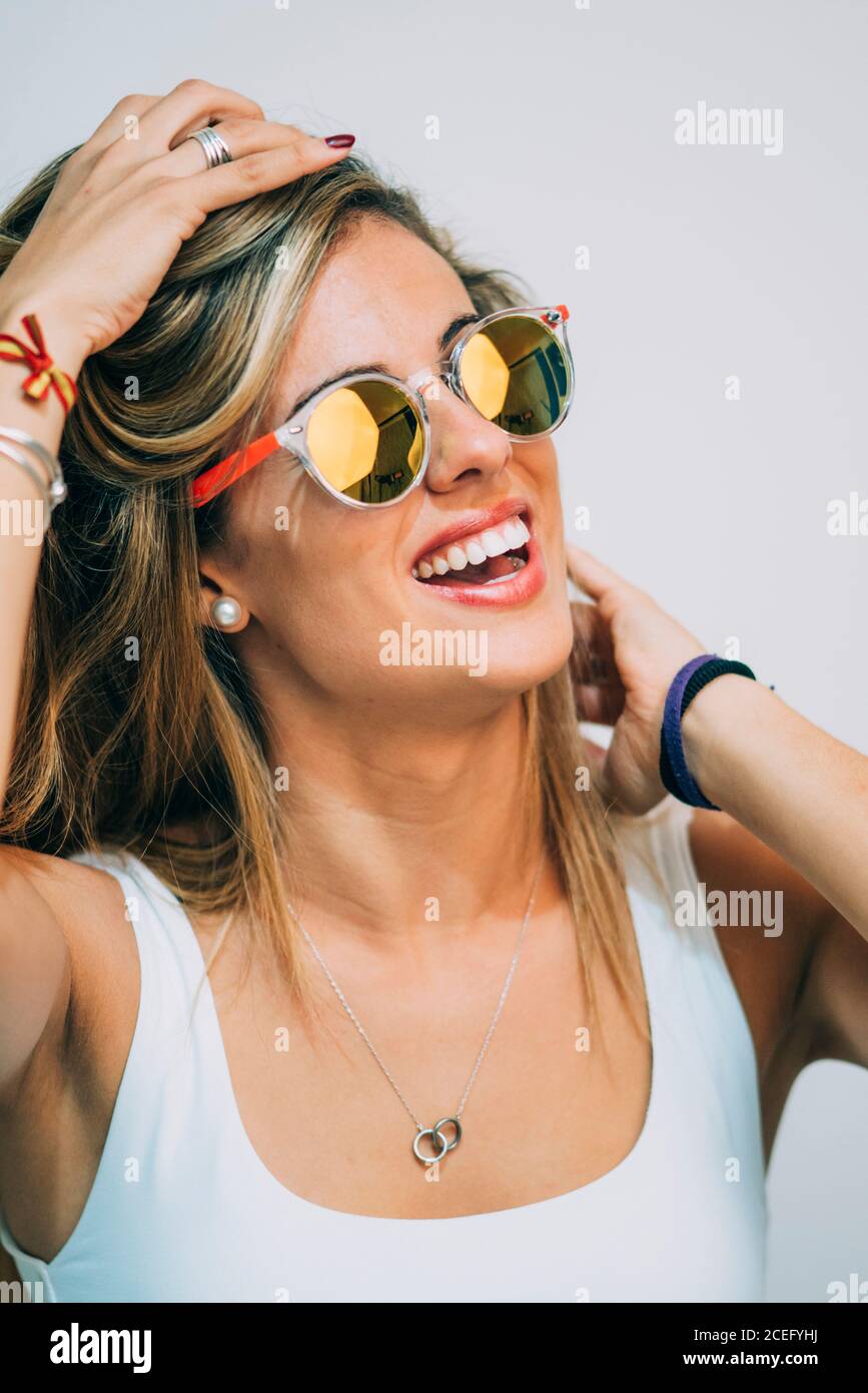 Woman touching hair hi-res stock photography and images - Alamy