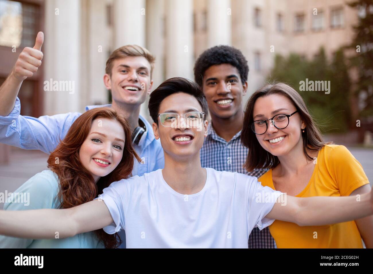 Cheerful Multicultural Students Posing Together Making Selfie Near University Building Stock ...