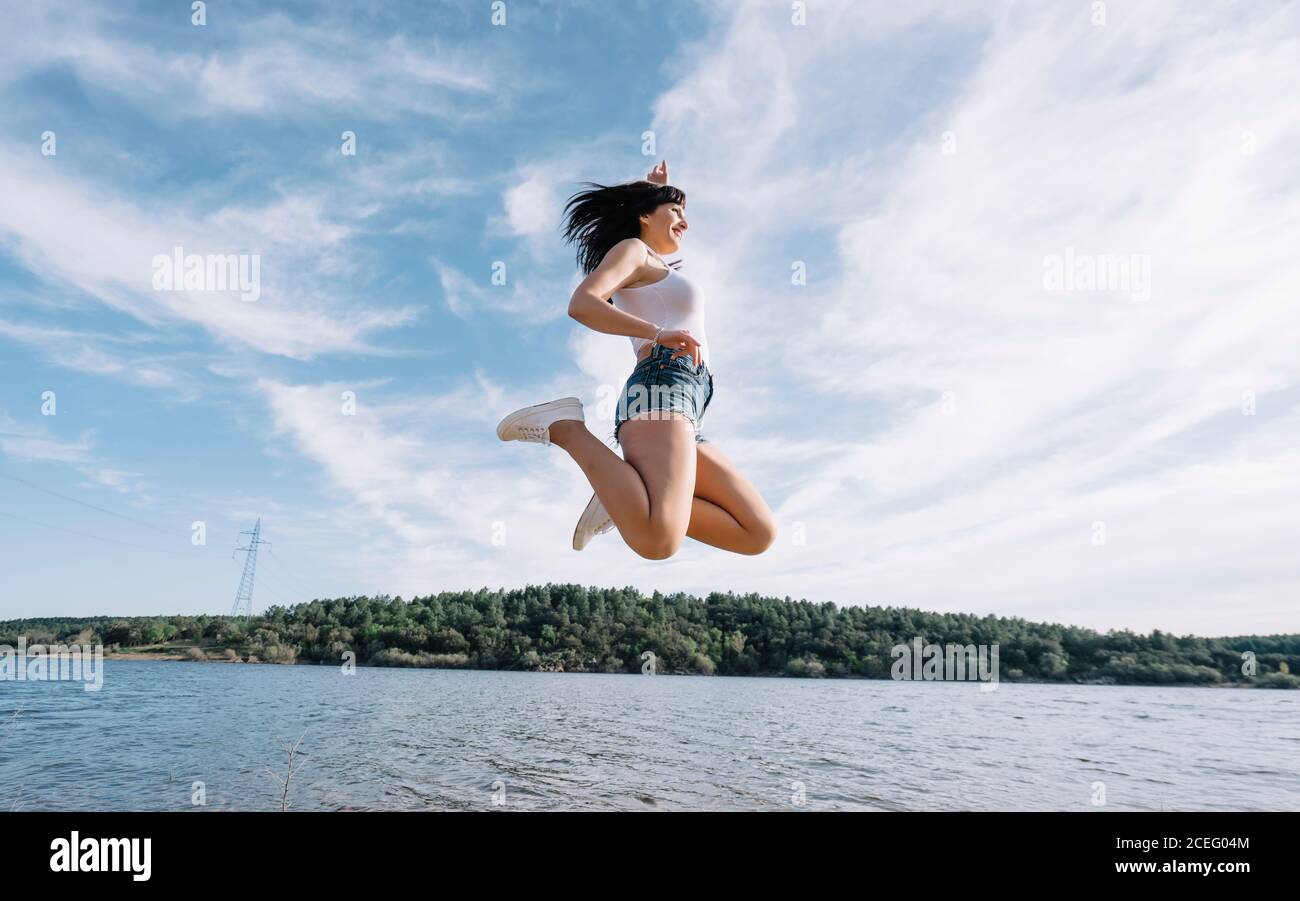 Woman jumps lake hi-res stock photography and images - Alamy