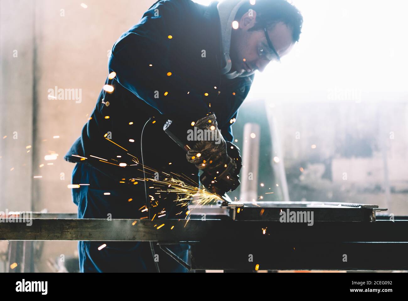 Man works grinder hi-res stock photography and images - Alamy