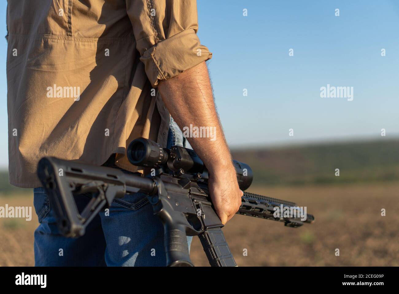 A rifle in a man's hand, close-up. Hunter with a weapon on the hunt ...