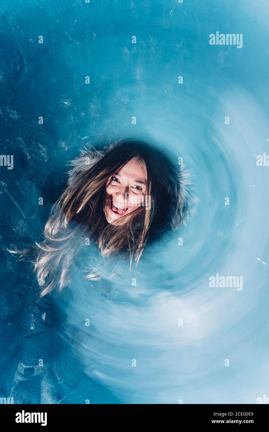 Woman standing in an ice cave hi-res stock photography and images - Alamy