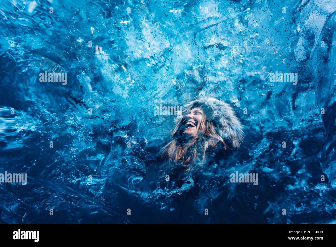 Woman behind pure blue ice Stock Photo - Alamy