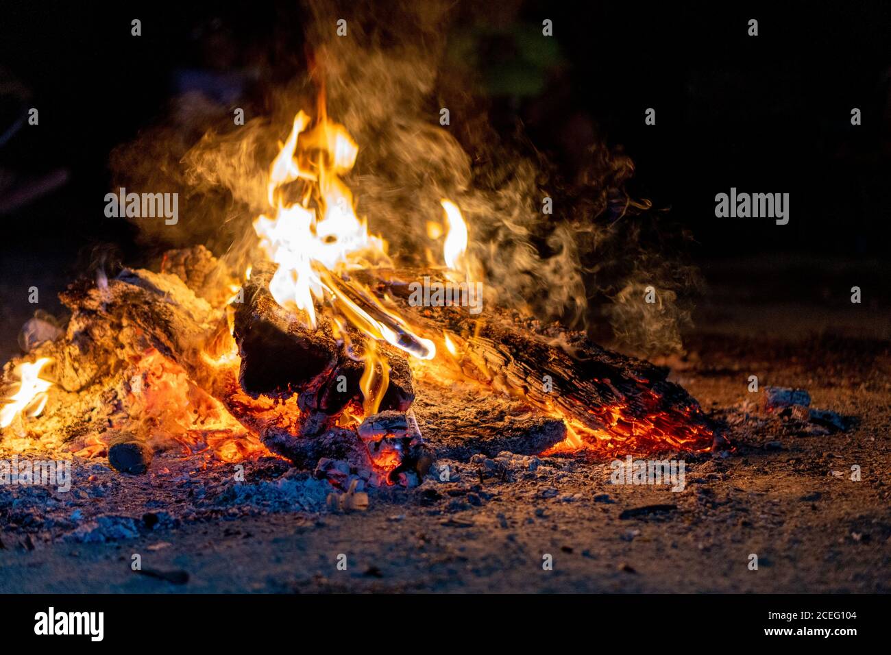 Bright beautiful bonfire at night, camping, horisontal Stock Photo - Alamy