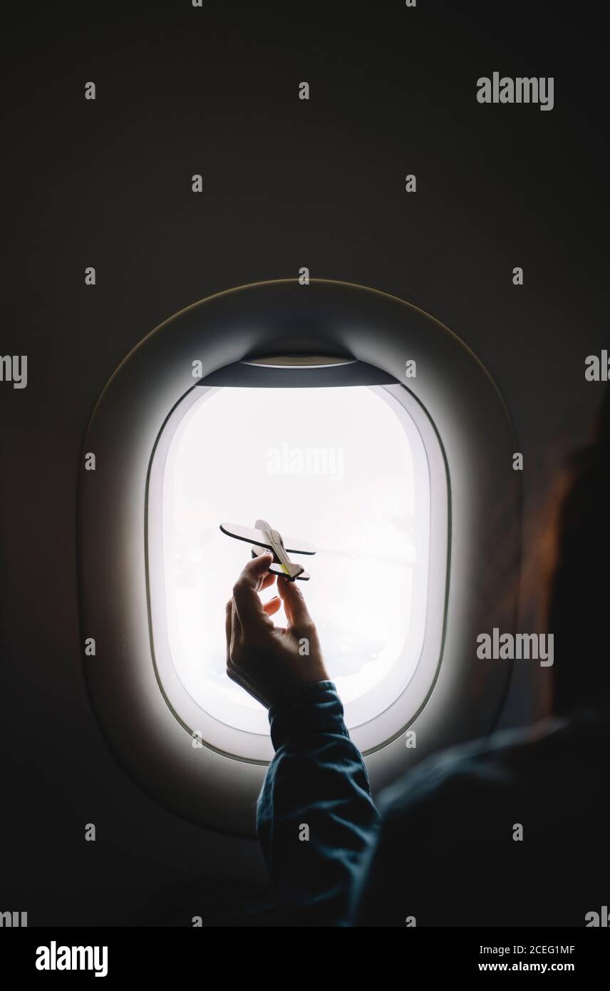 Woman shows airplane model in window Stock Photo - Alamy