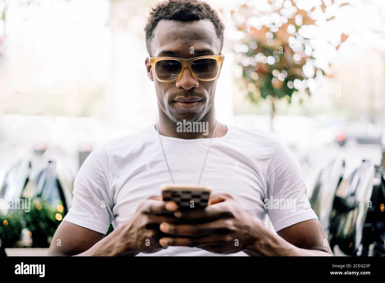 African man using mobile phone Stock Photo - Alamy