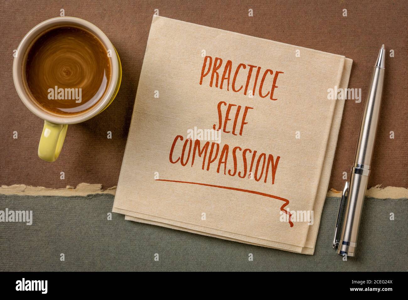 practice self-compassion inspirational handwriting on a napkin with ...