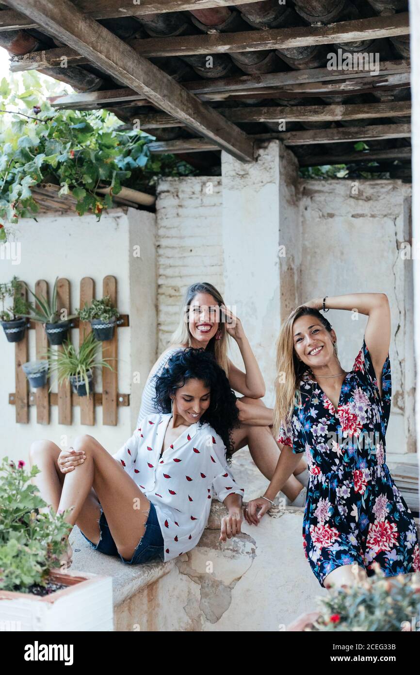 Three girls posing on the street Stock Photo - Alamy