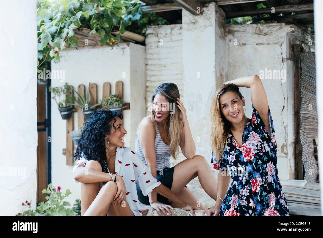 Three girls posing on the street Stock Photo - Alamy