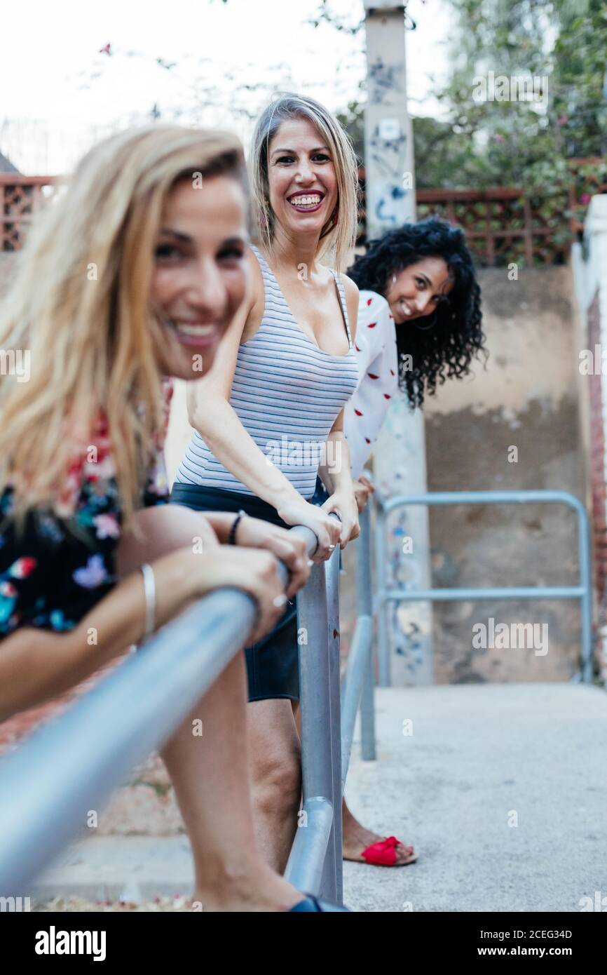 Three girls playing on the street Stock Photo - Alamy