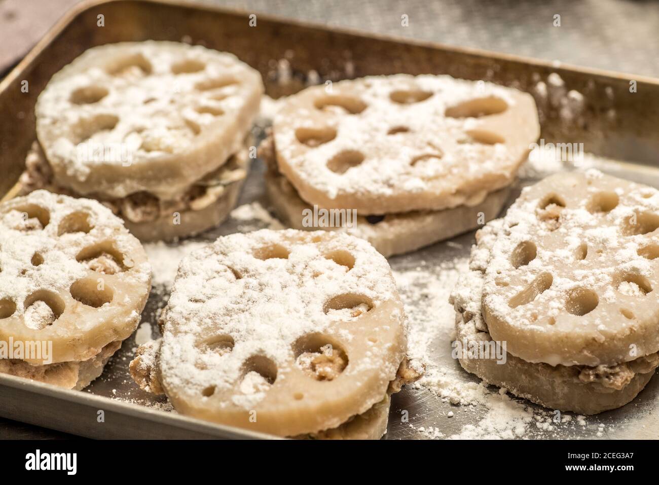 Cooking lotus root meat stuffed sandwiches Stock Photo - Alamy