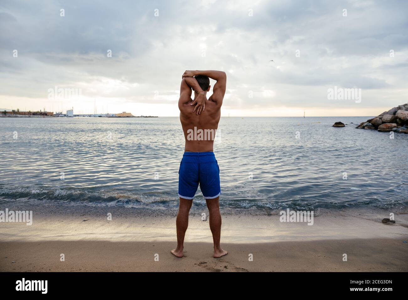 Back view of man doing stretching hi-res stock photography and images ...