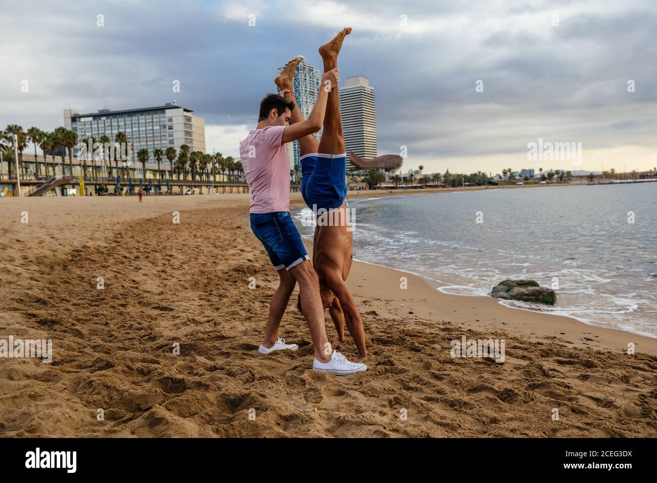 Young man doing two handstand hi-res stock photography and images - Alamy