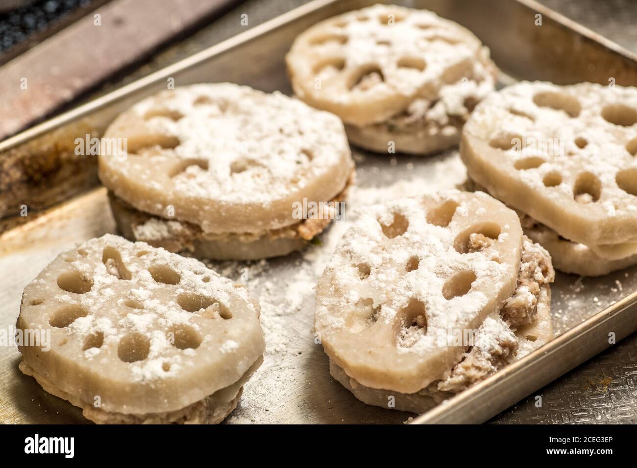 Cooking lotus root meat stuffed sandwiches Stock Photo - Alamy