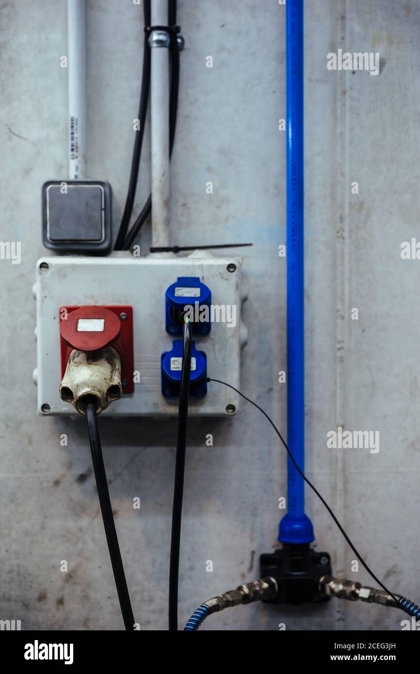 Electricity plugs in a mechanical garage Stock Photo - Alamy