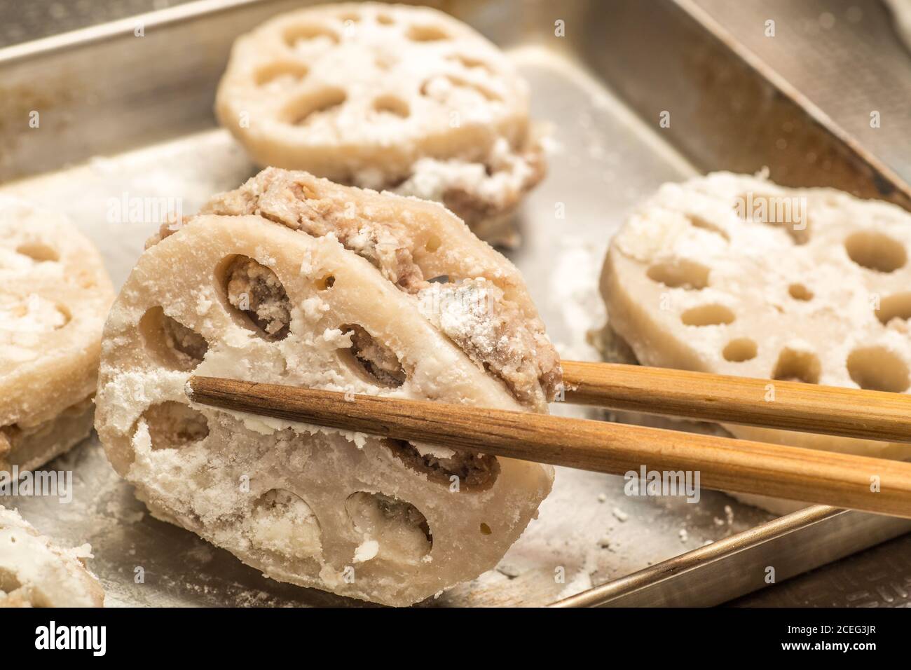 Cooking lotus root meat stuffed sandwiches Stock Photo - Alamy