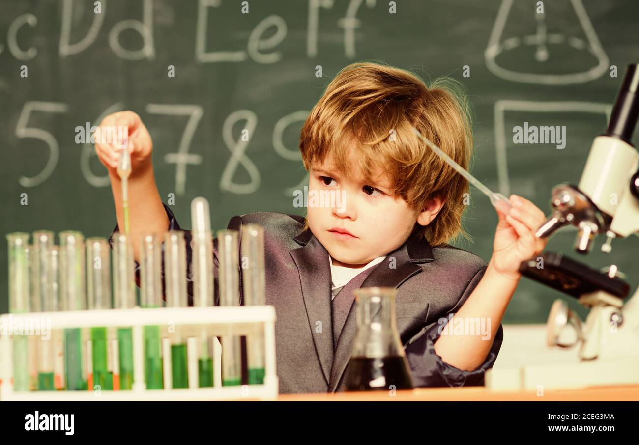 Boy test tubes liquids chemistry. Chemical analysis. Kid study ...