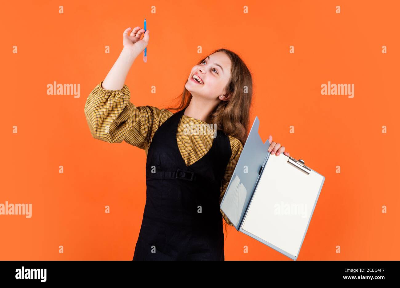 look here. kid presenting project. child is working with paper ...