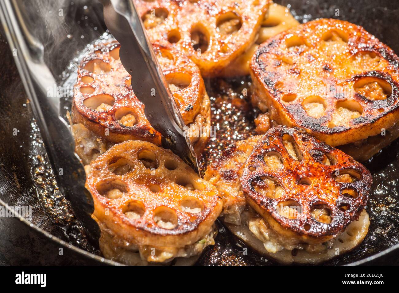 Cooking lotus root meat stuffed sandwiches Stock Photo - Alamy