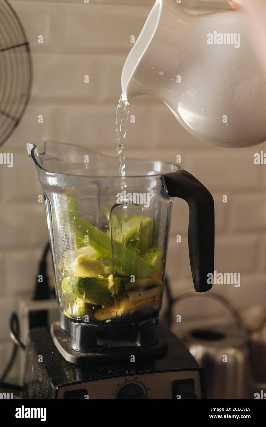 Pouring water pitcher bowl hi-res stock photography and images - Alamy