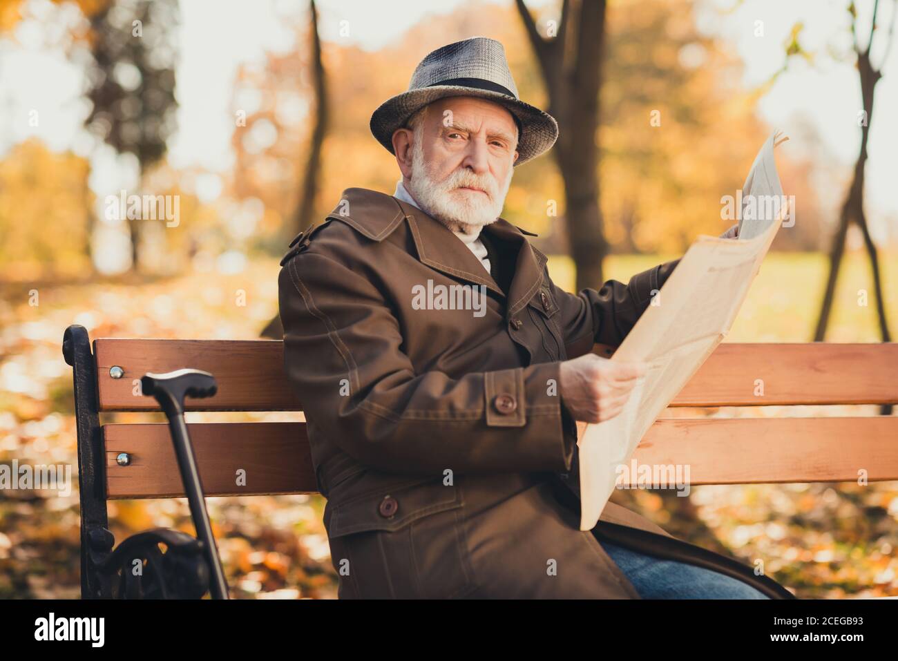 Photo of serious old man grumpy pensioner dont like kids play autumn ...
