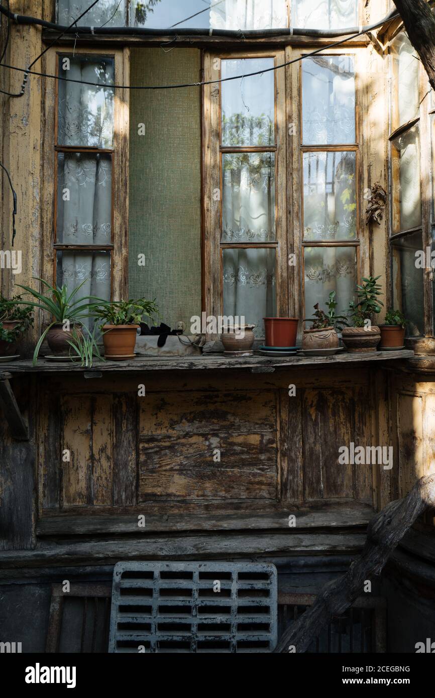 Outdoors view of old open wooden window with narrow casement with ...
