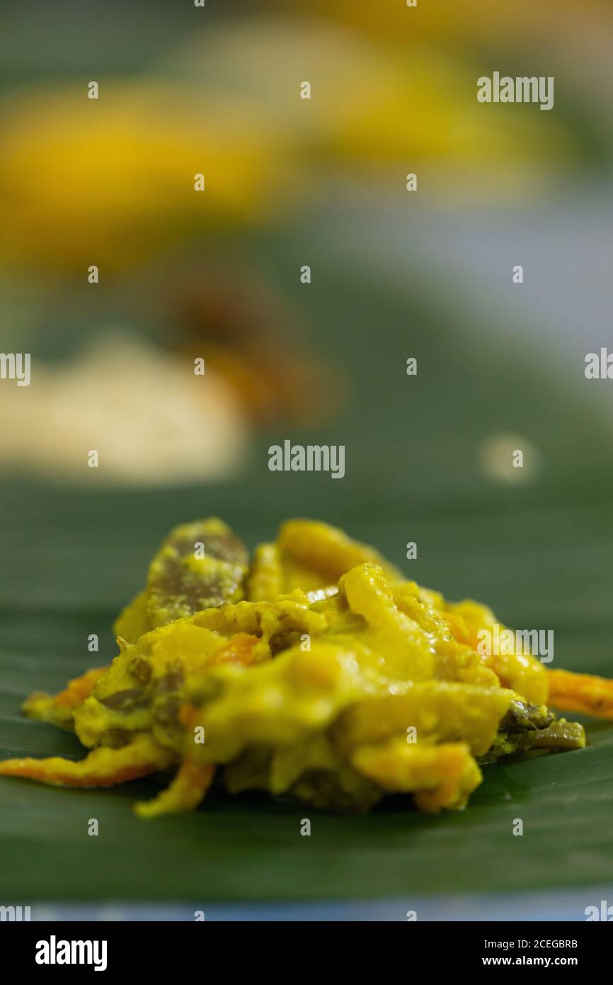 Traditional Kerala food laid out on a banana leaf during the Onam ...