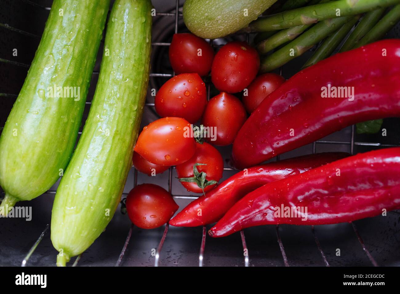 Woman washing fresh vegetables in kitchen Stock Photo - Alamy