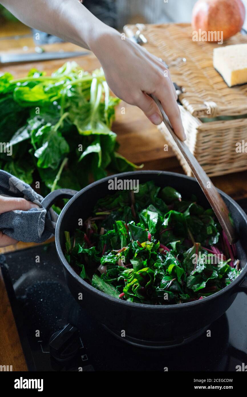 Woman stirring pot on stove hi-res stock photography and images - Alamy