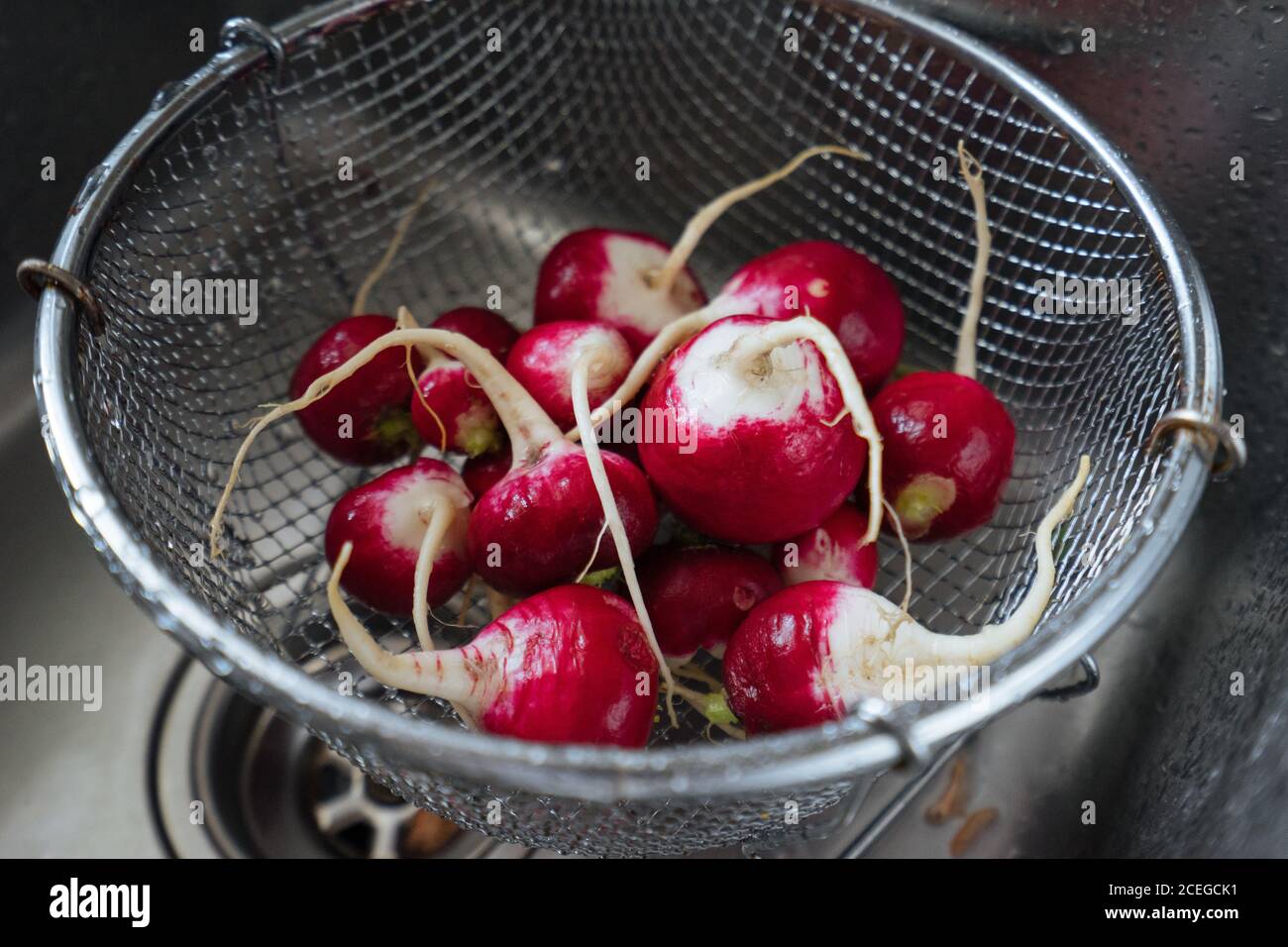 Woman washing fresh vegetables in kitchen Stock Photo - Alamy