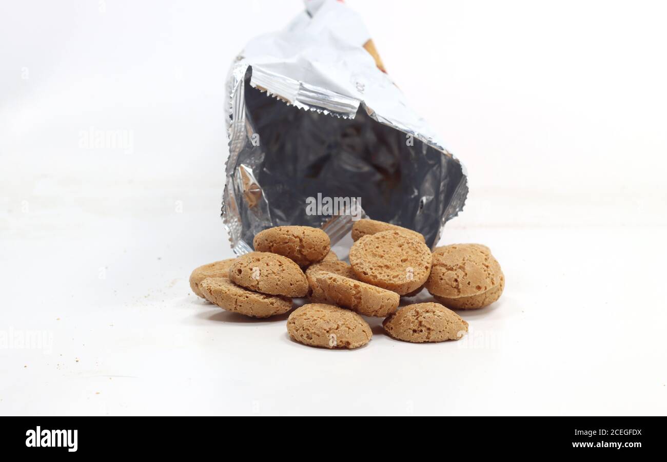 Open pack of amaretti biscuits isolated on a white background Stock ...