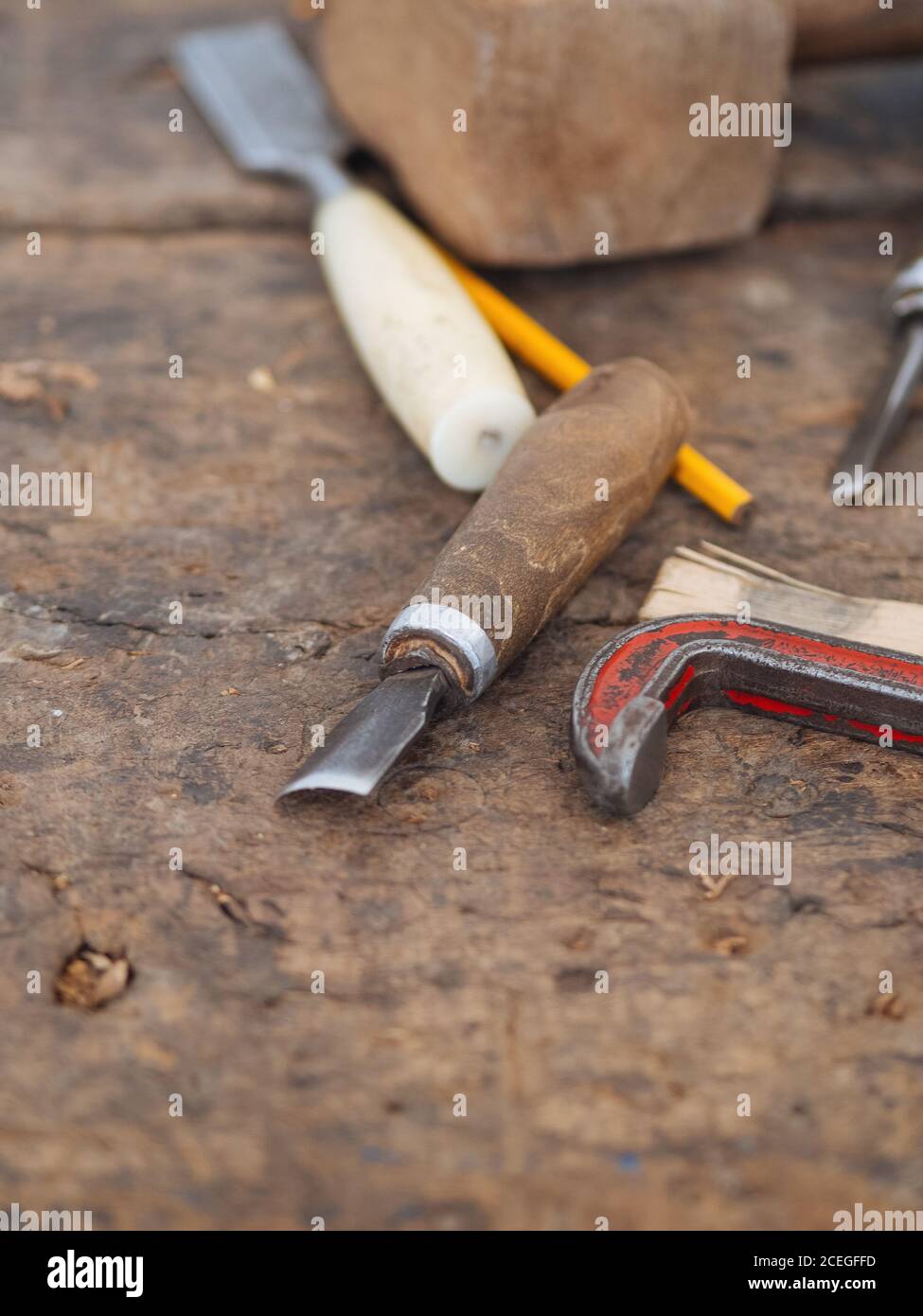 From above shot of shabby wooden table with set of craft tools for ...