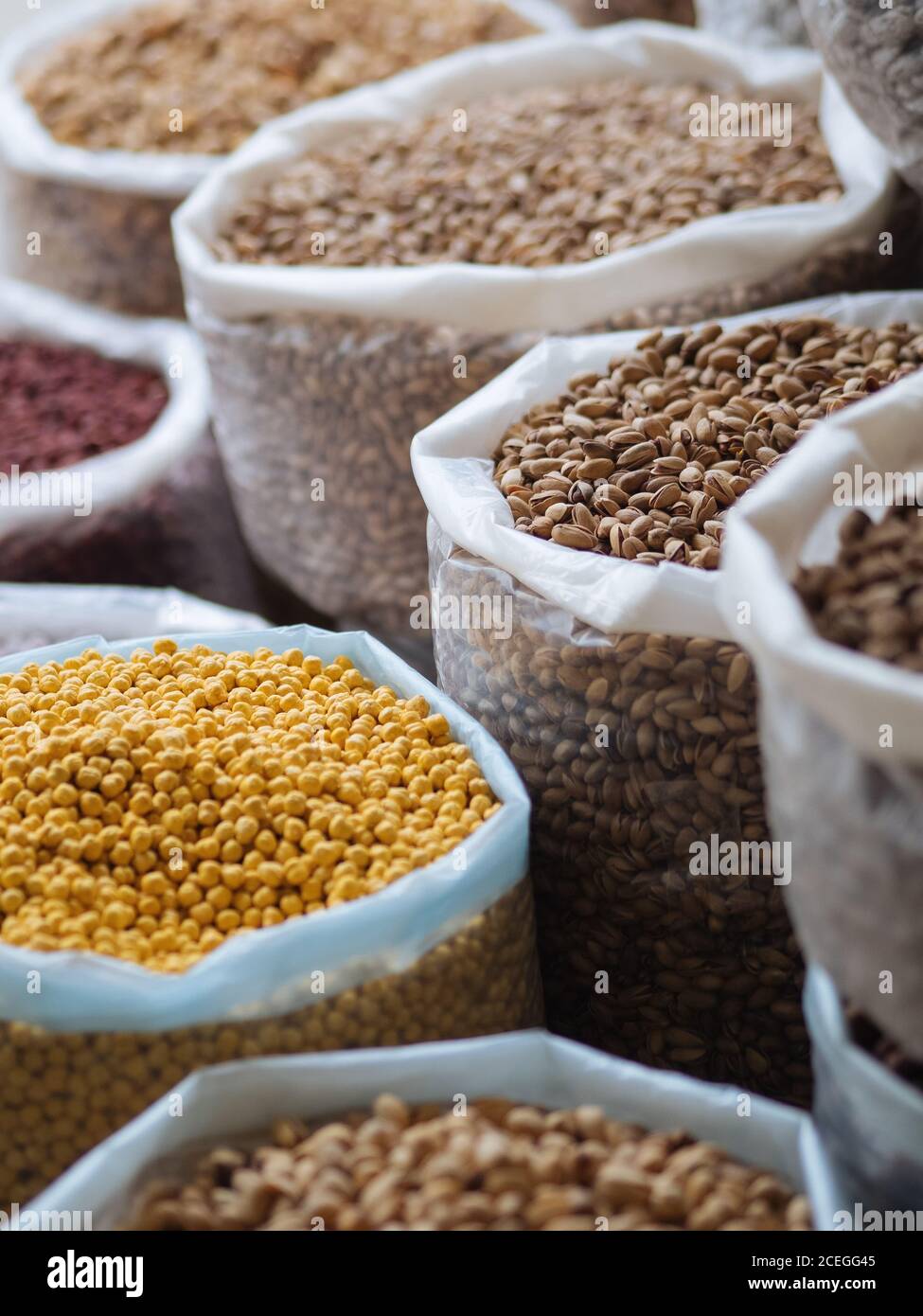 Top view fabric bags filled various grains aromatic spices condiments ...