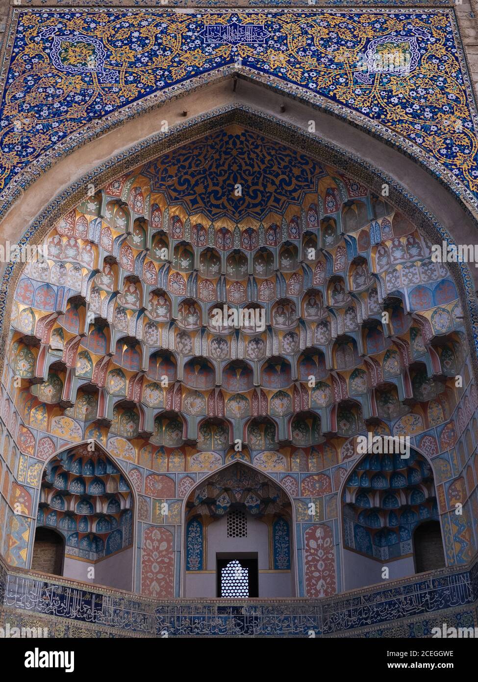 From below inside shot of amazing design of mosque cupola with colorful ...