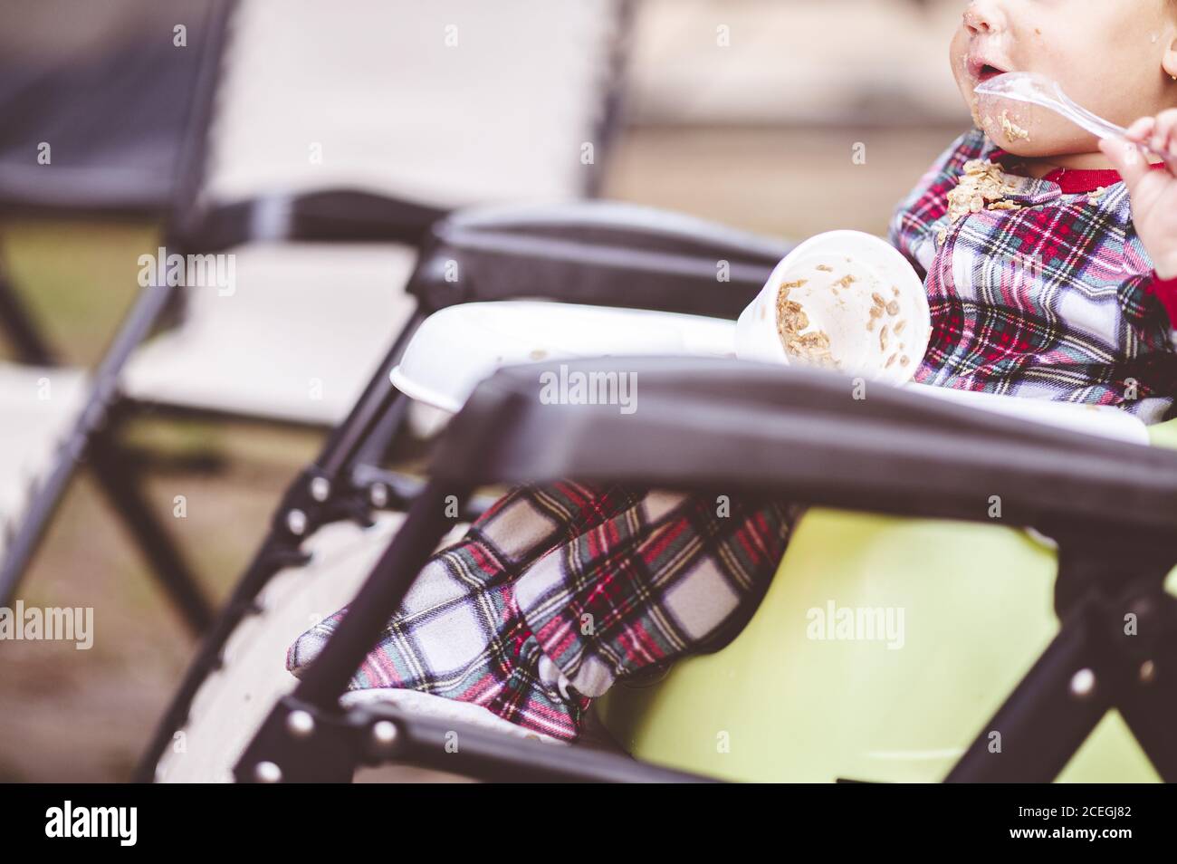 Closeup focus portrait of an adorable messy-eating child Stock Photo ...