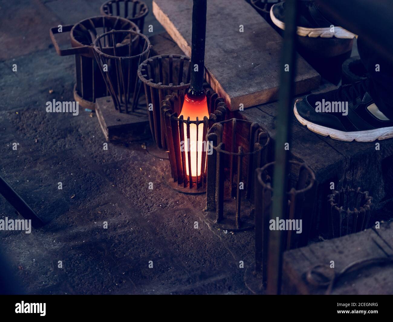 Closeup hand of crop anonymous artisan in glove using braver and ...