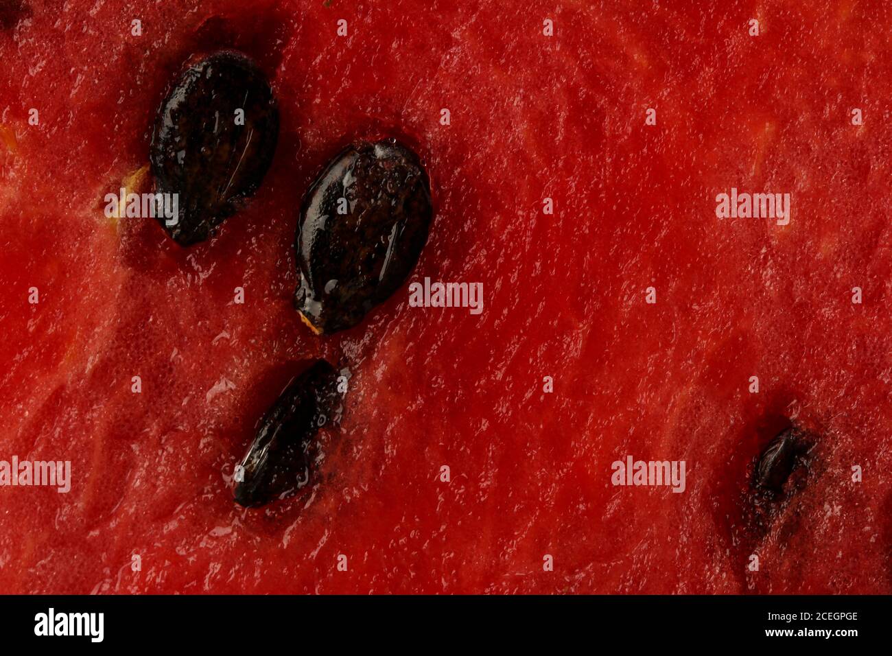 Red ripe watermelon pulp with seeds close-up as background Stock Photo ...