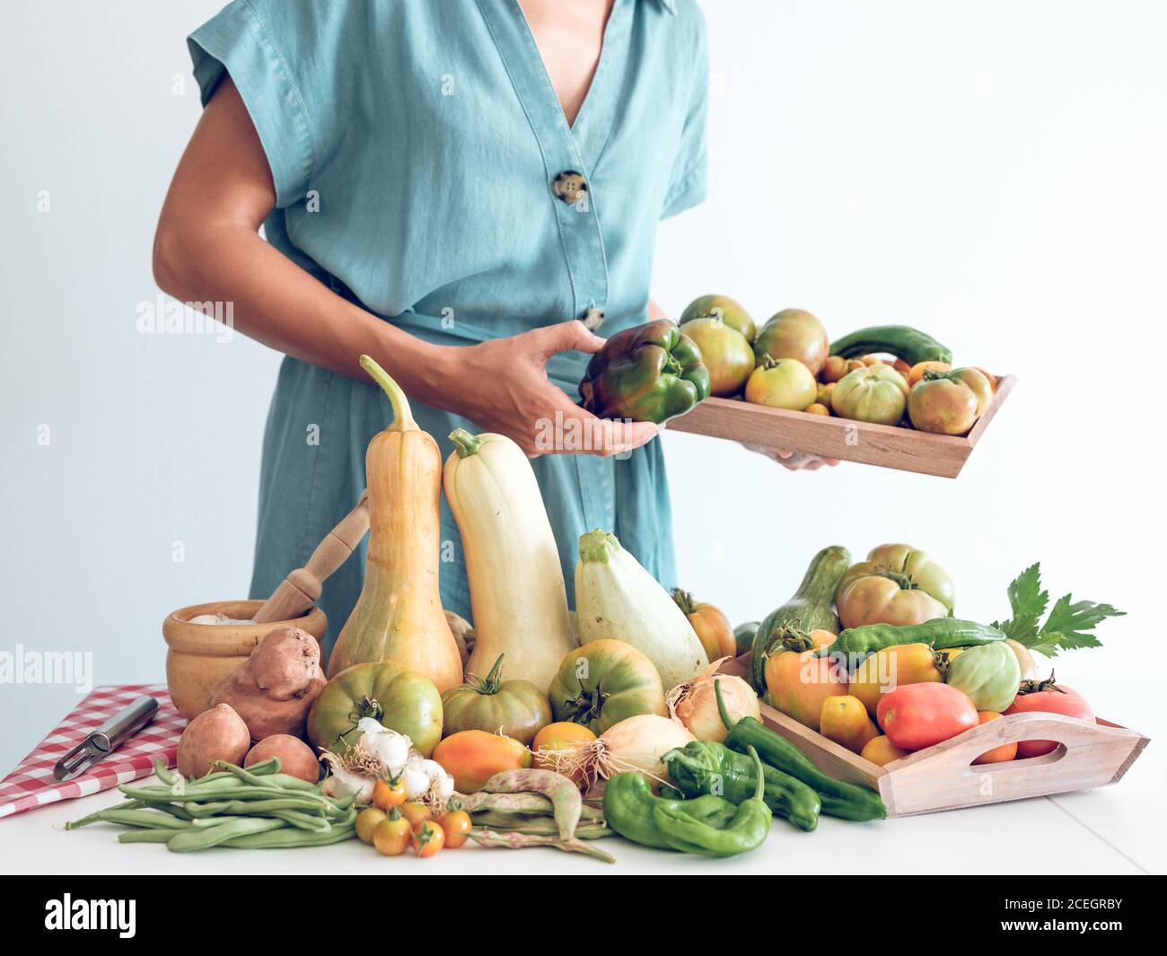 Crop unrecognizable Woman preparing fresh tasty vegetables for cooking ...