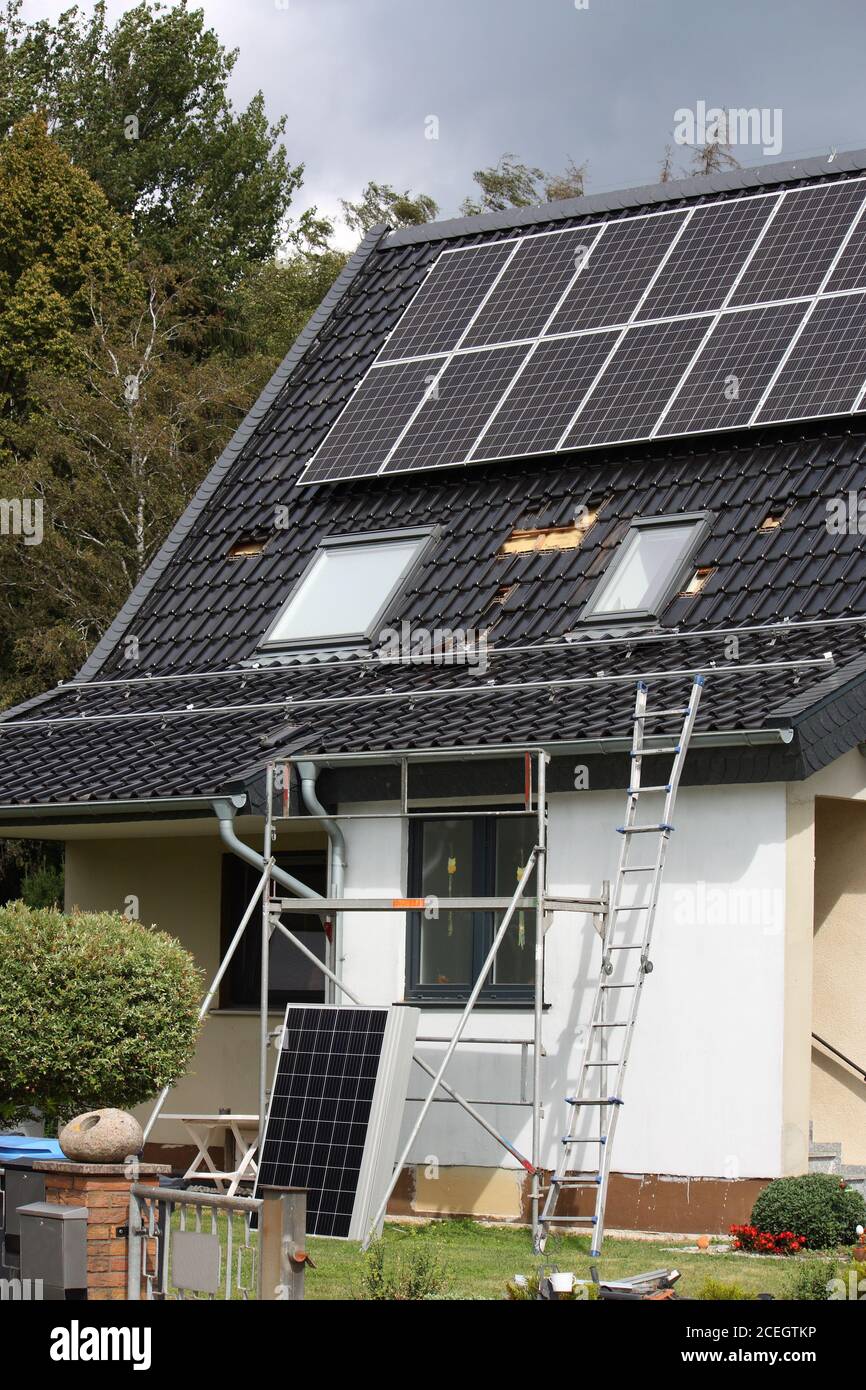 Vertical shot of tools and a ladder for installing solar panels to a ...
