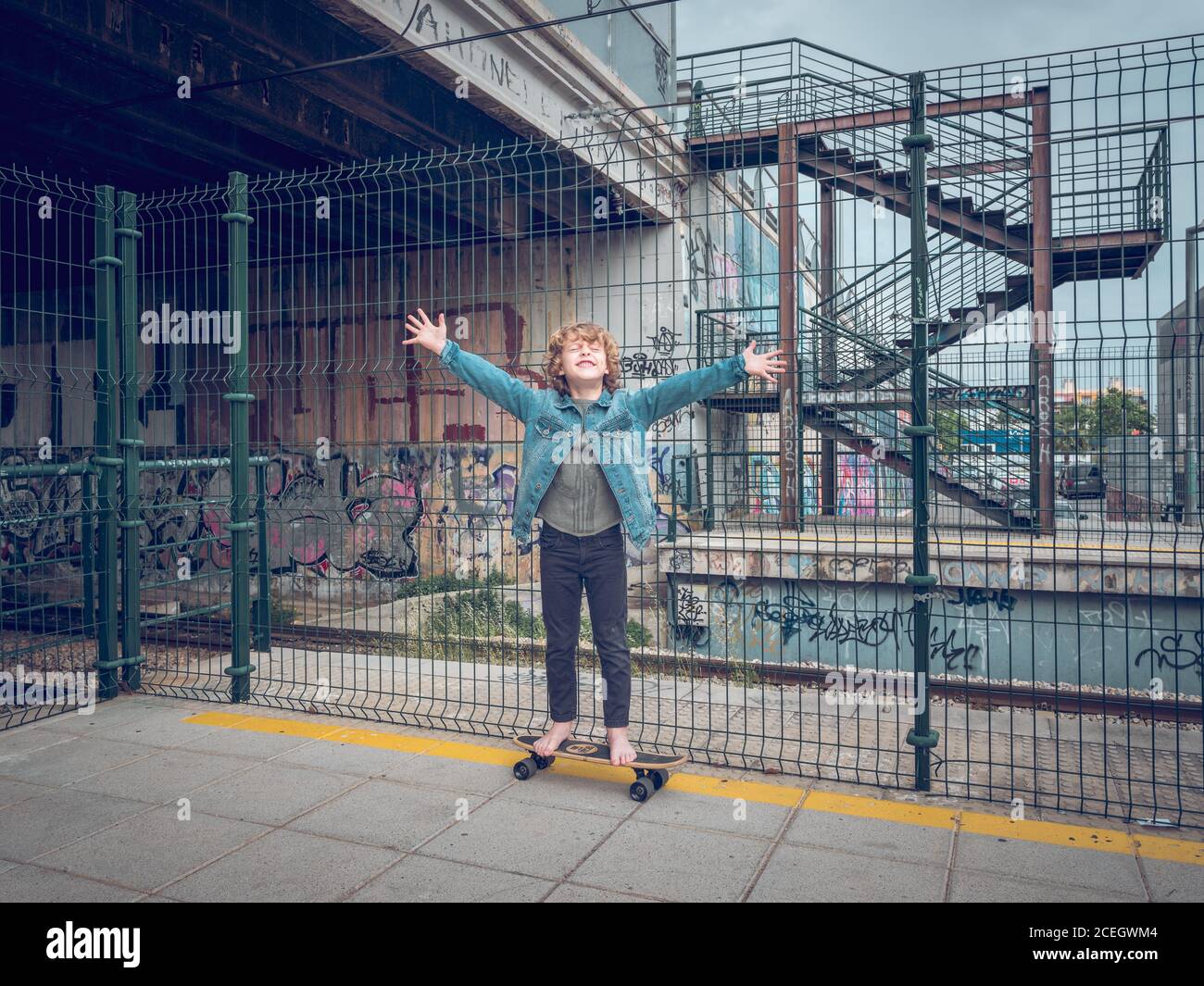 Funny boy with rising hands Stock Photo - Alamy