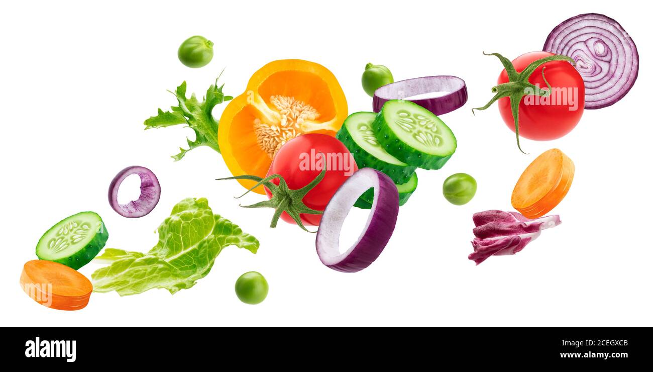 Falling vegetables, fresh salad ingredients isolated on white ...