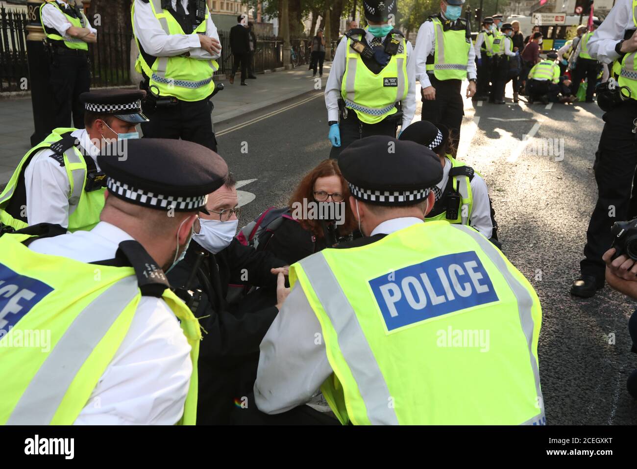 Police talk to Extinction Rebellion demonstrators in Parliament Square ...