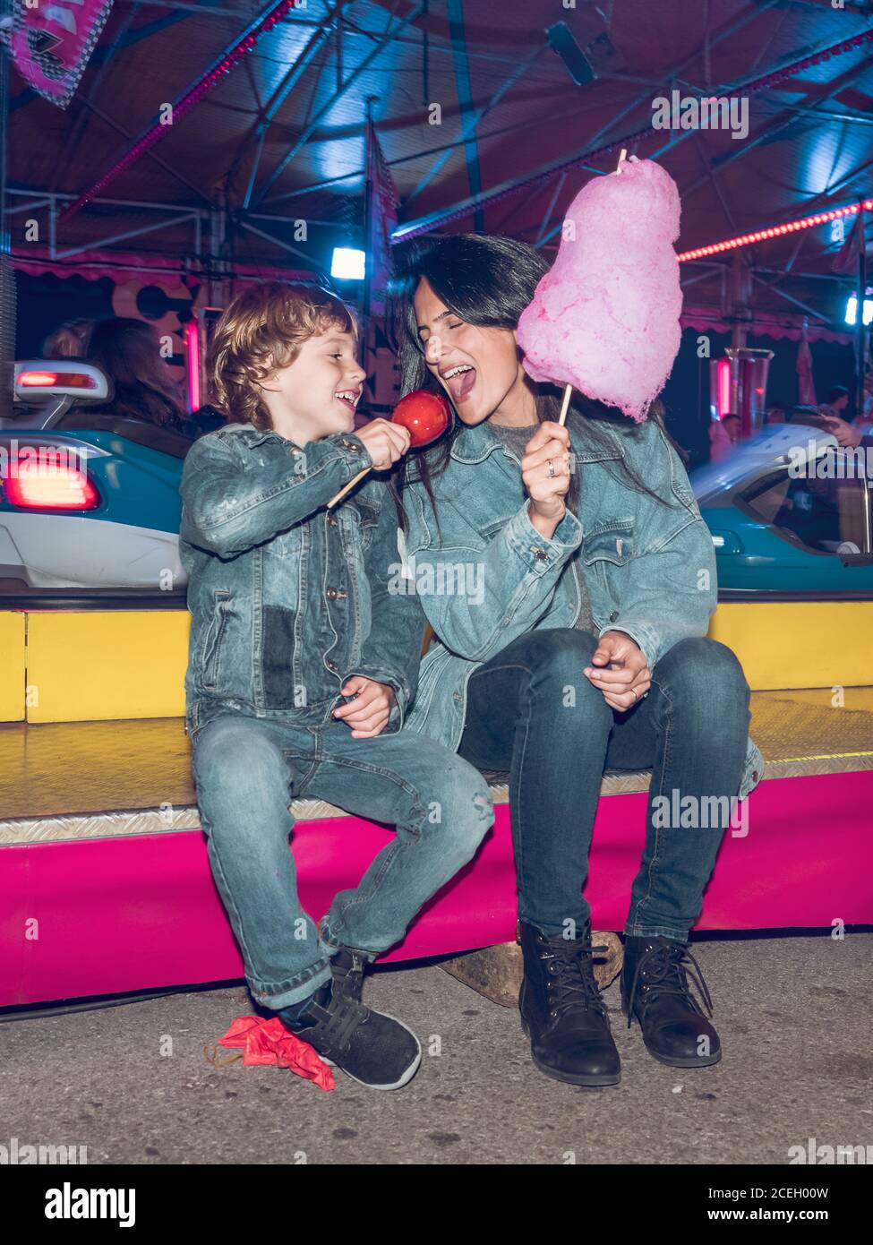 Mother and son with snacks on funfair Stock Photo - Alamy