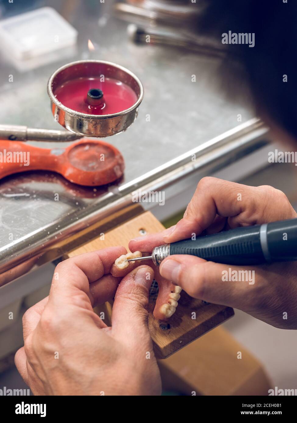 Dental technician making denture Stock Photo - Alamy