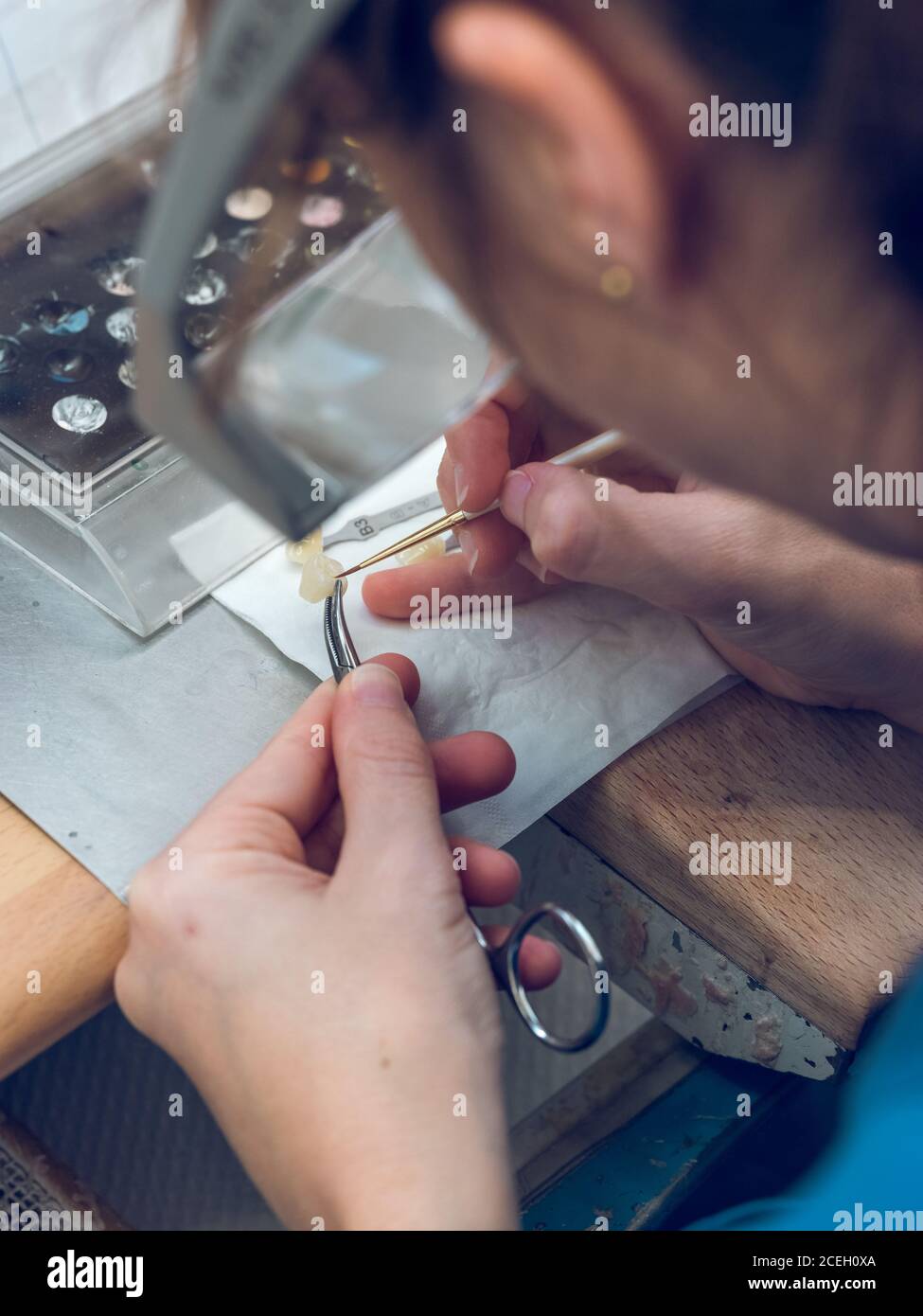 Crop hands carving tooth Stock Photo - Alamy
