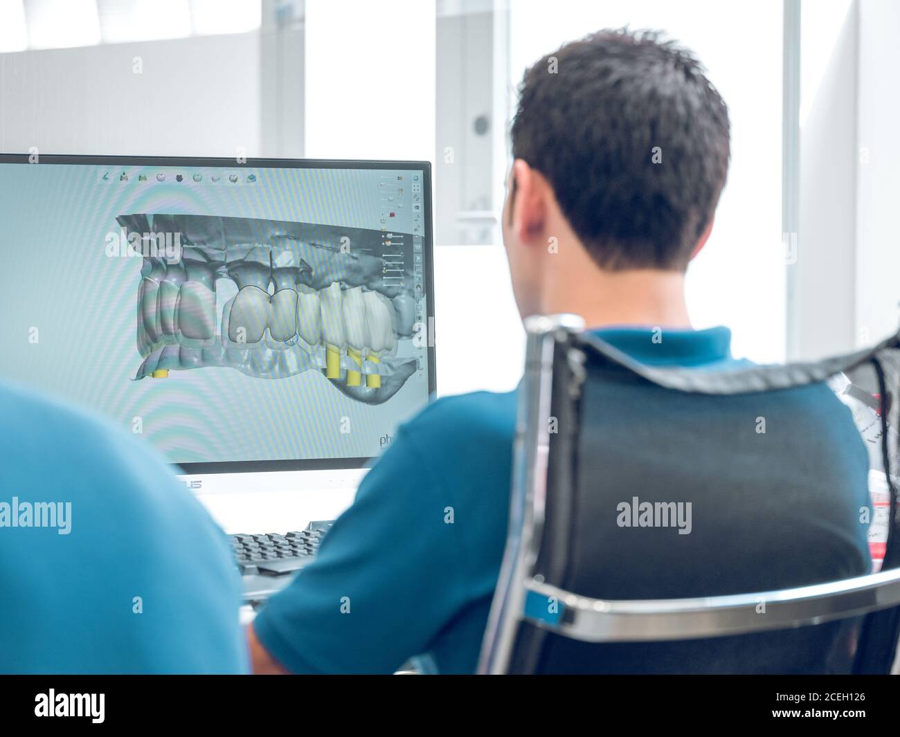 faceless man modeling denture on computer Stock Photo - Alamy