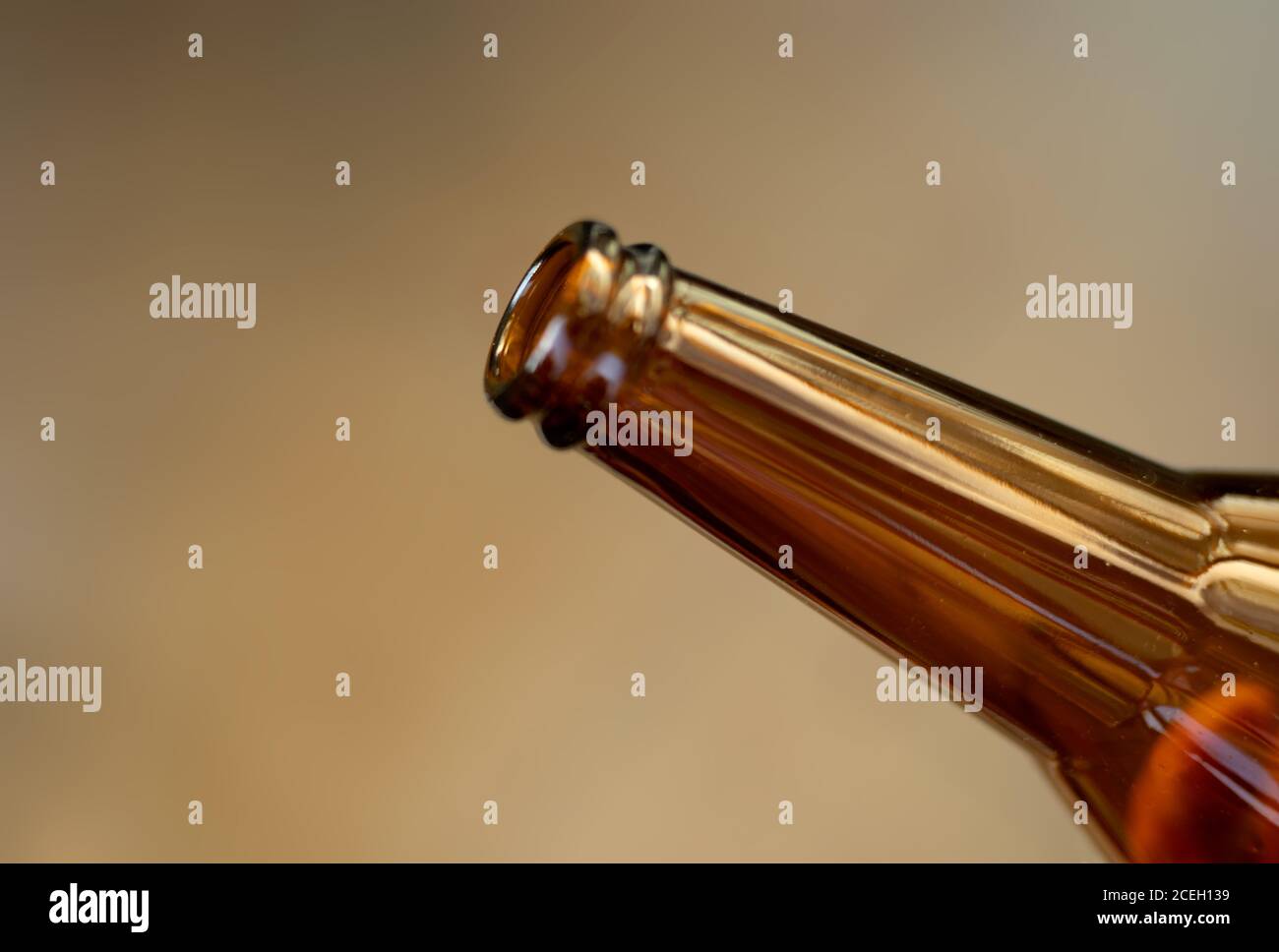 Close-up view of brown glass bottle. Focus on the rim Stock Photo - Alamy