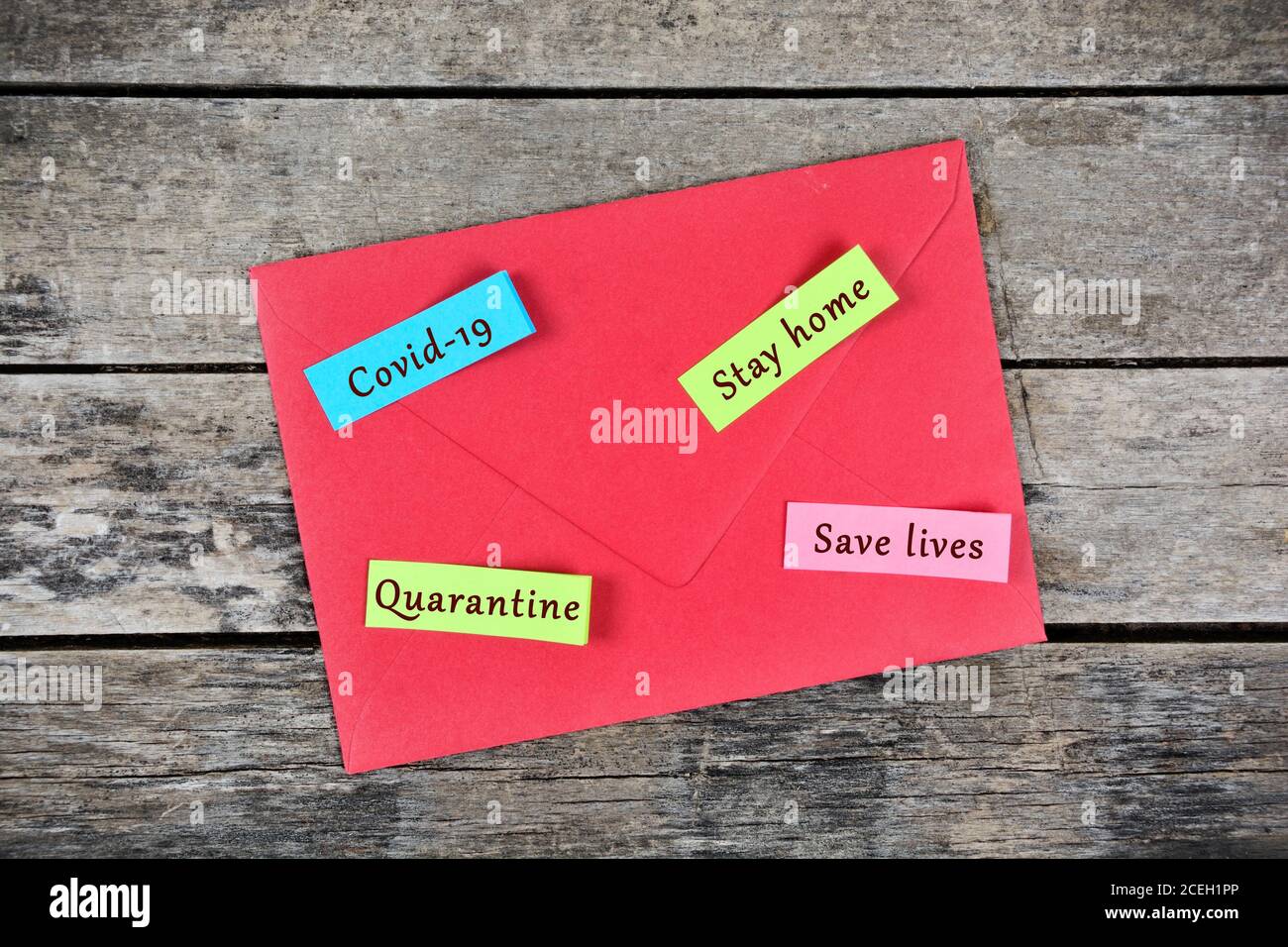 Covid -19 Quarantine Stay home Save lives words on a colorful sticky ...